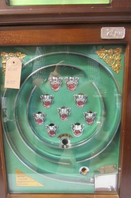 A nine cup slot machine | Hartleys Auctioneers & Valuers
