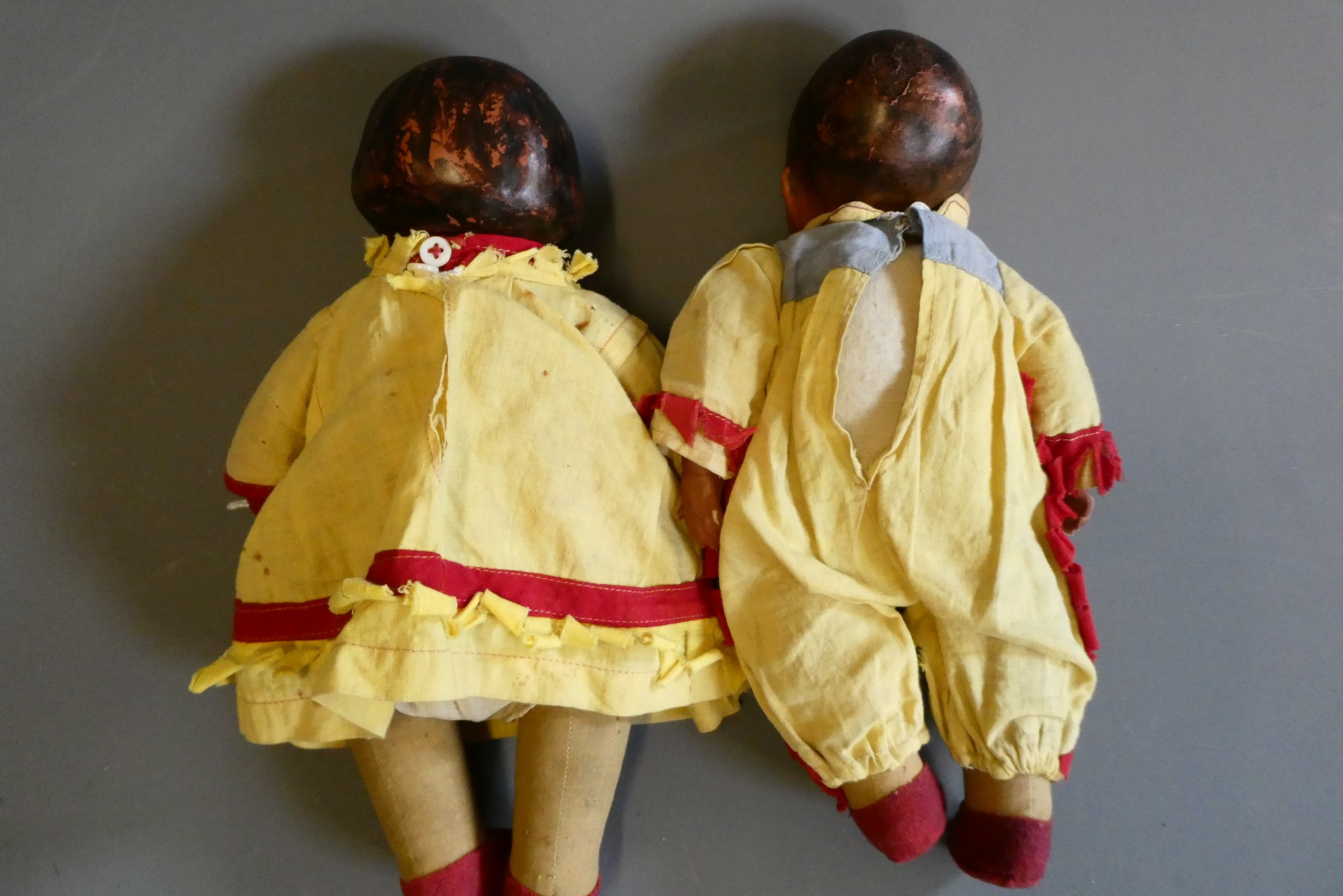 Two vintage composition head dolls, comprising a 1920s horseman and a ...