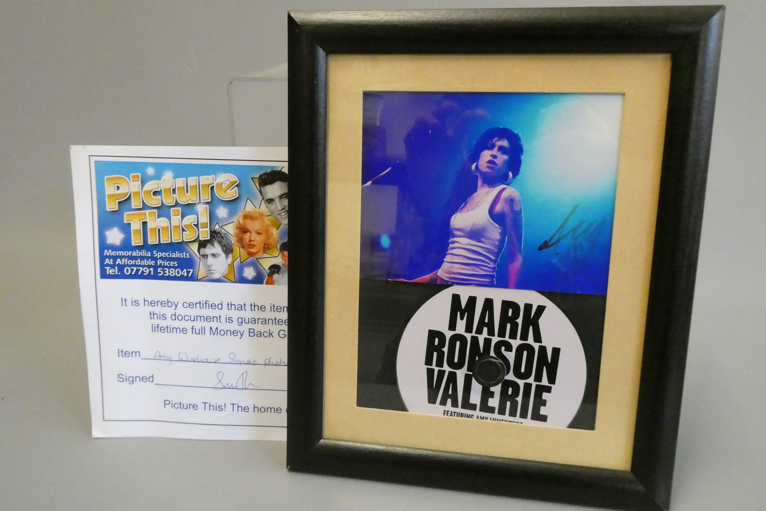 Signed photograph of amy winehouse, framed with mark ronson valerie cd ...