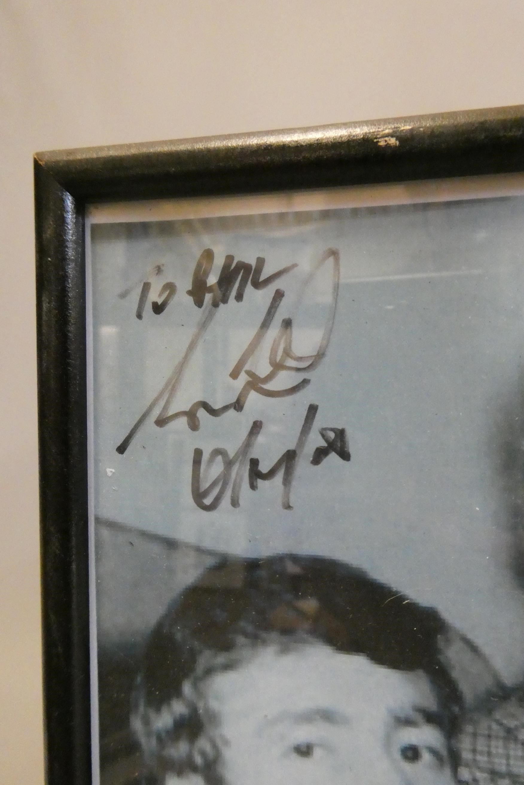 Two photographs signed by sam leach, photographed with members of the ...