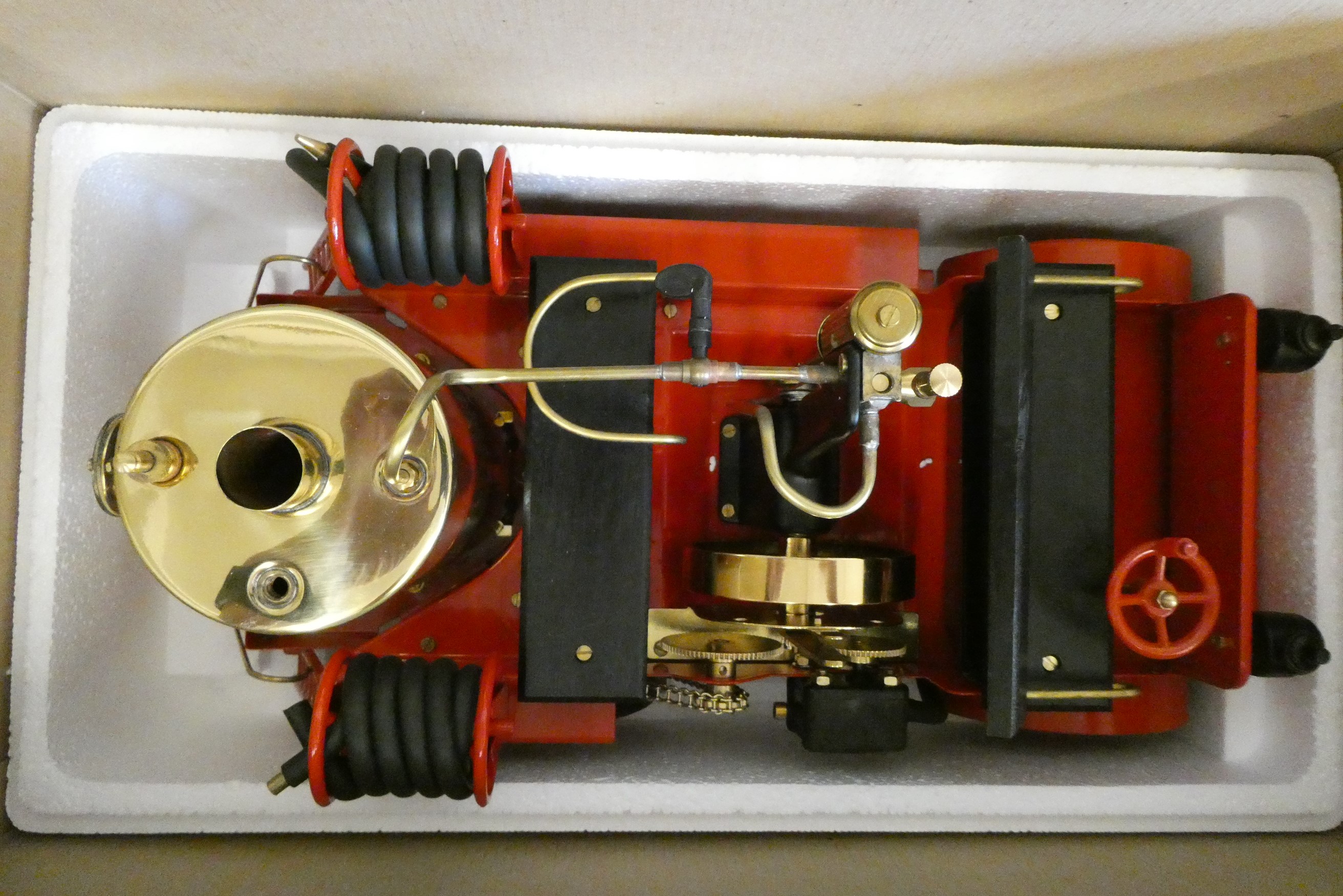 Wilesco fire engine with four firemen figures, box e-m (est. plus 24% ...