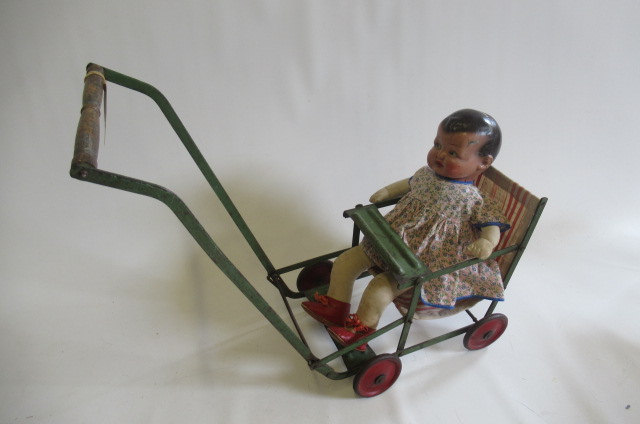 A painted metal dolls pushchair | Hartleys Auctioneers & Valuers