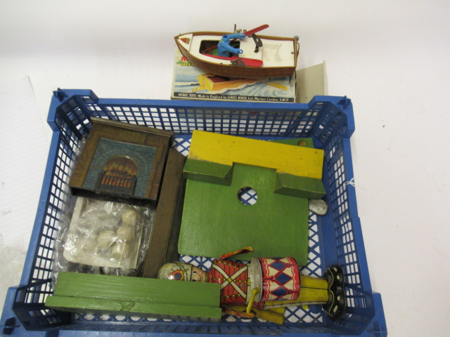 A collection of tin and plastic toys including rowing boat | Hartleys ...