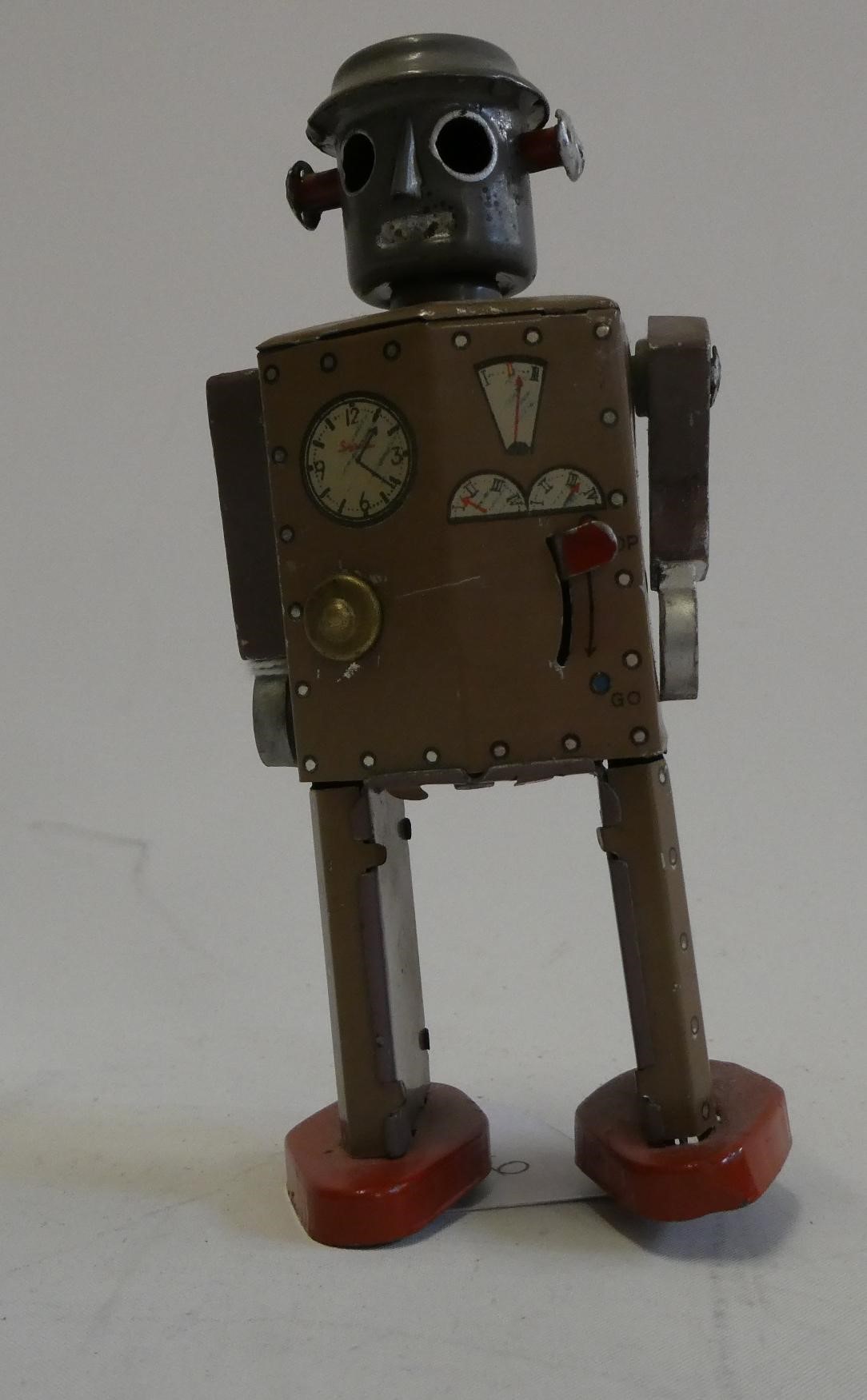 An original 1940 s version of the clockwork atomic man tinplate robot ...