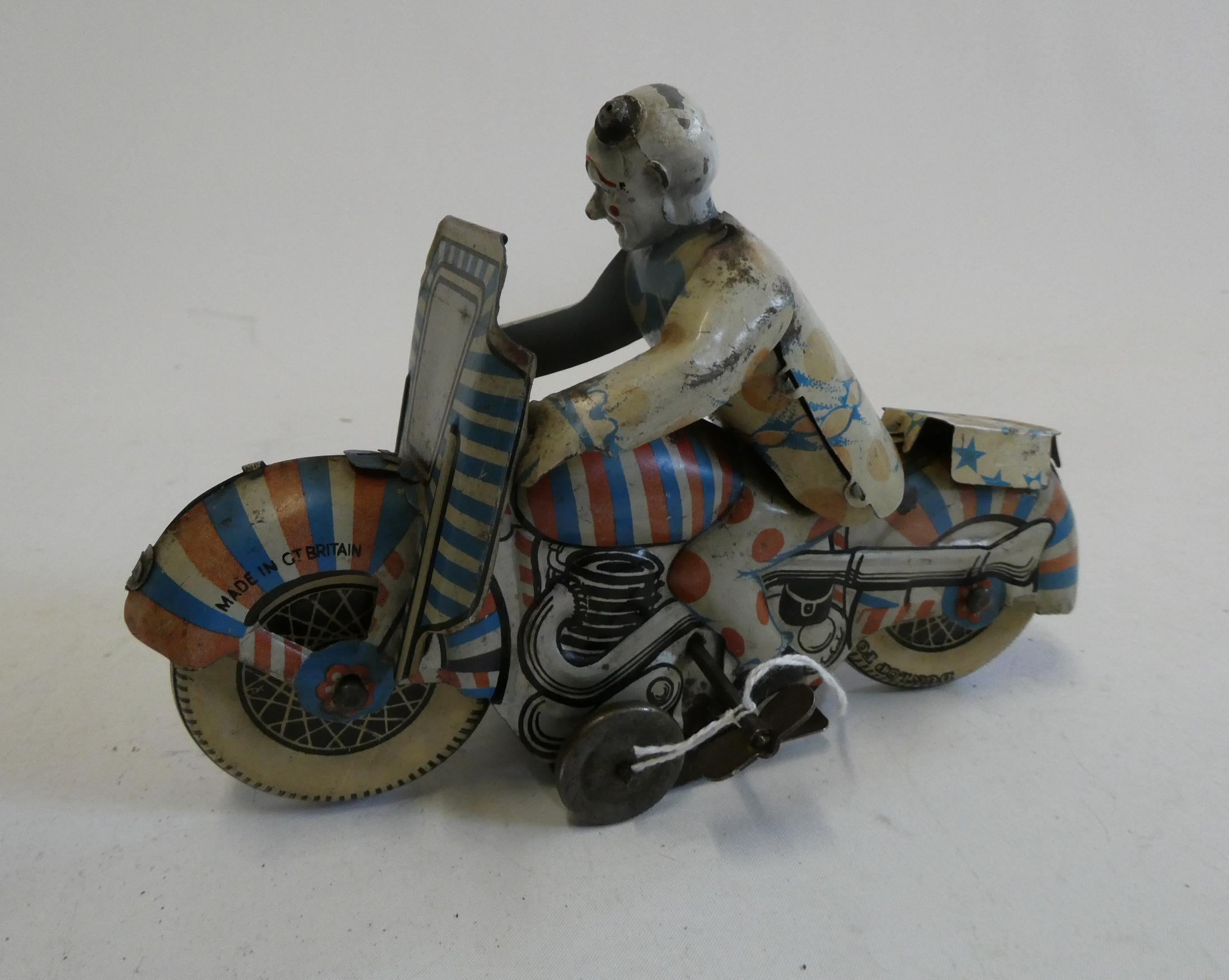 Mettoy clockwork clown motorcycle, tinplate finish has sunlight fading ...