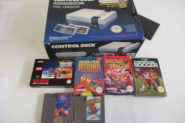 Nintendo n.e.s. version game system with six game cassettes | Hartleys ...