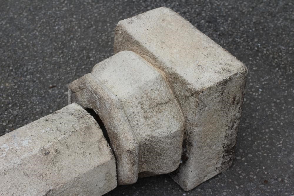 A cast stone gothic arch, the octagonal supports on ogee moulded base ...