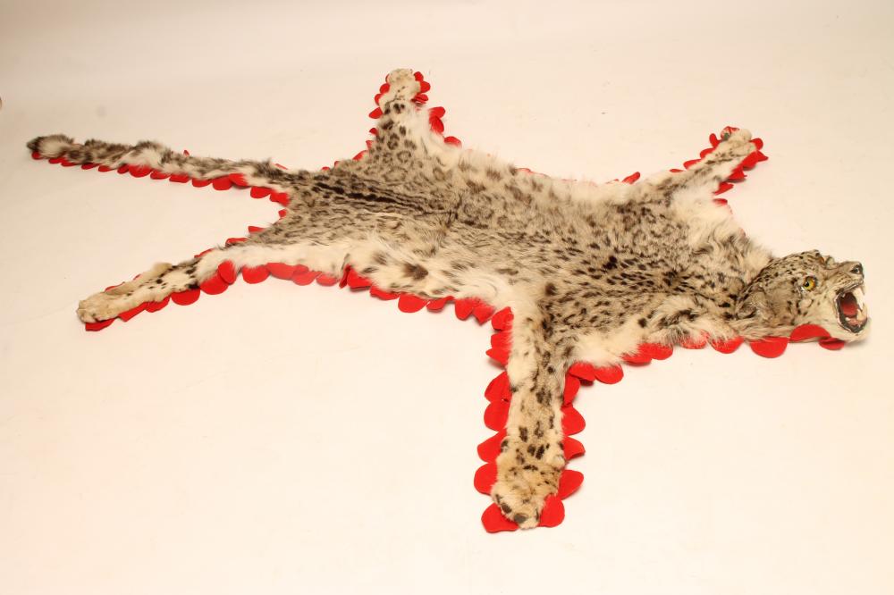 A snow leopard skin rug | Hartleys Auctioneers & Valuers