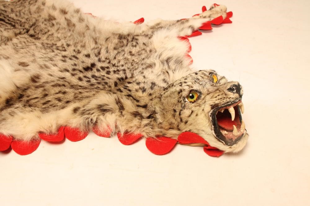 A snow leopard skin rug | Hartleys Auctioneers & Valuers