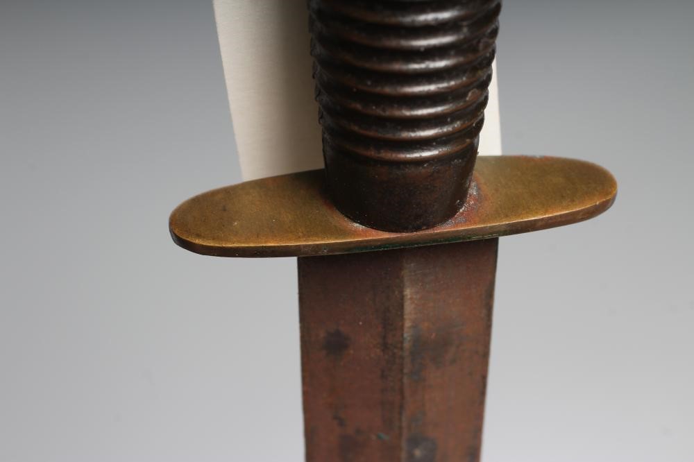 A fairbairn & sykes dagger with 7" double edged blade, brass crossguard ...