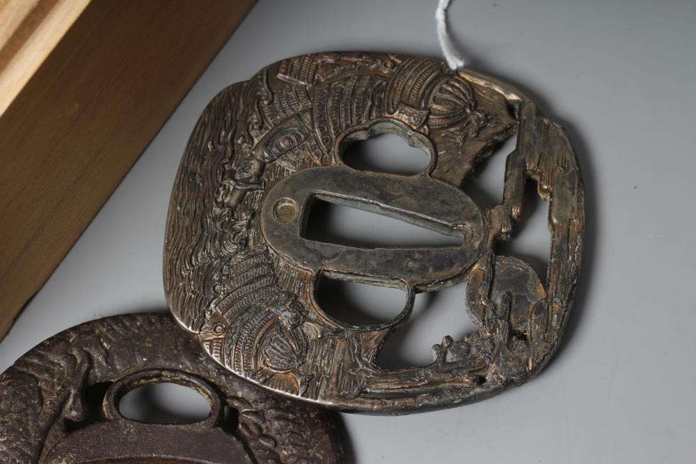 A collection of katana accessories comprising five tsuba, two cleaning ...