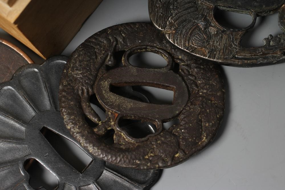 A collection of katana accessories comprising five tsuba, two cleaning ...
