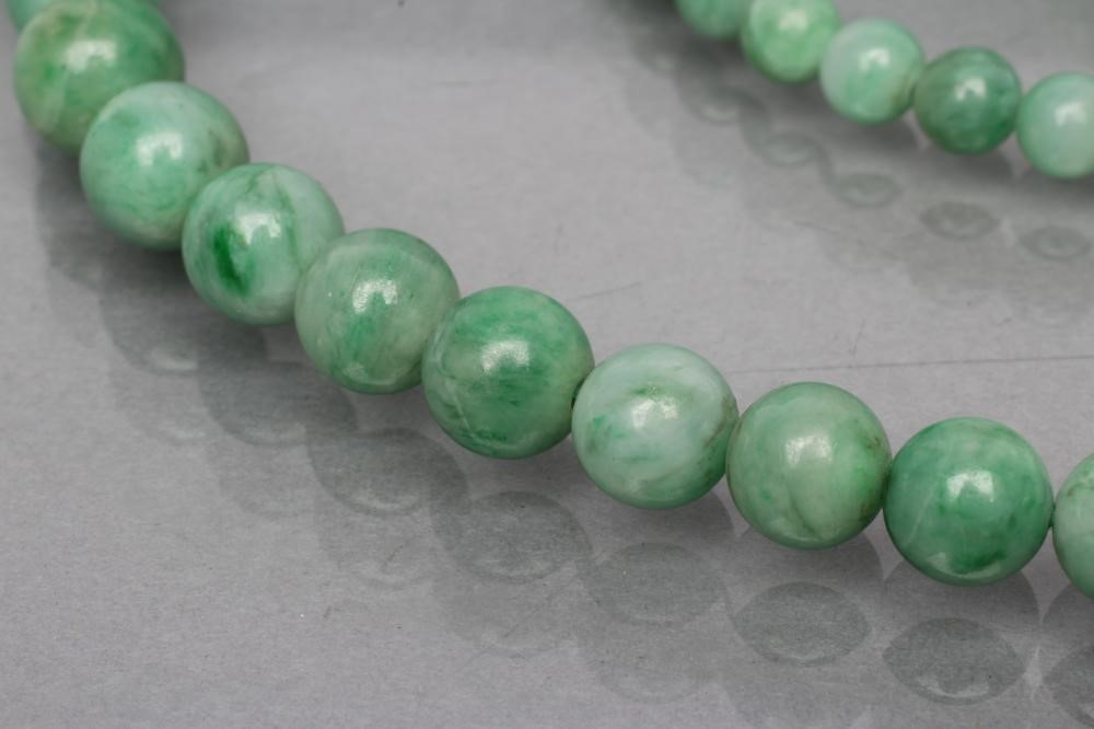 A string of polished graduating jade beads | Hartleys Auctioneers & Valuers