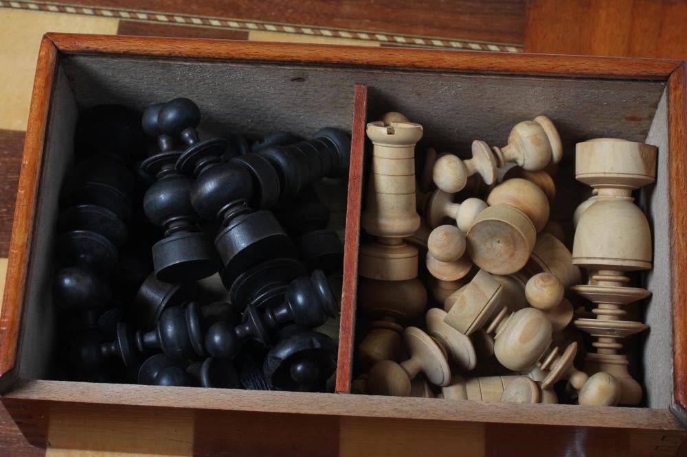A turned wood chess set in natural and stained black | Hartleys ...