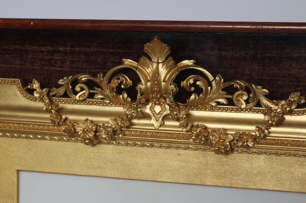 A victorian gilt gesso picture frame of earred oblong form with pierced ...