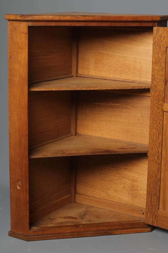 Acorn industries george grainger - an adzed oak corner cupboard | Hartleys Auctioneers & Valuers