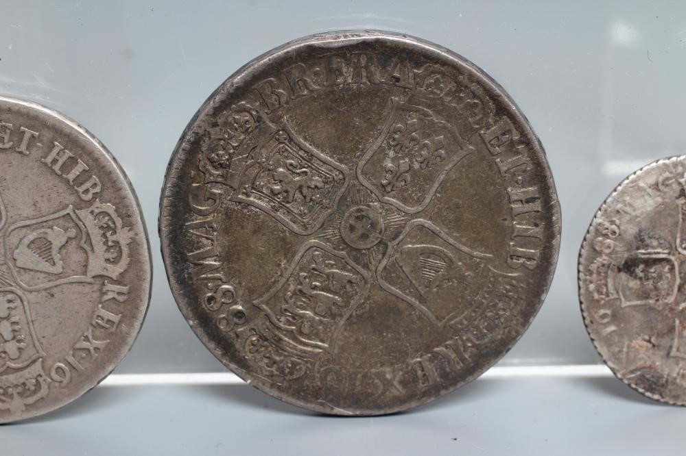 Three james ii silver coins, comprising a 1688 crown with crown ...