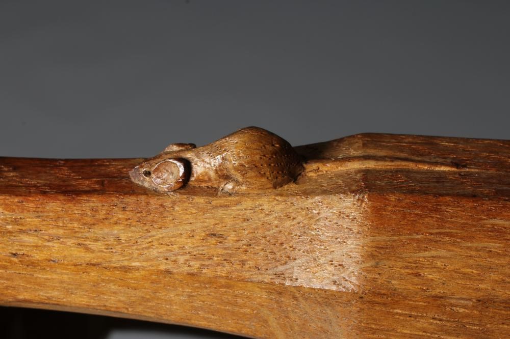 A robert thompson adzed oak stool of oblong form with strapwork cow ...