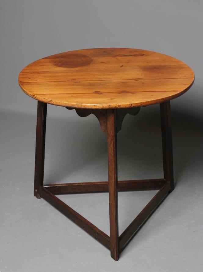 A cricket table, 19th century and later, the fruitwood top and waved ...