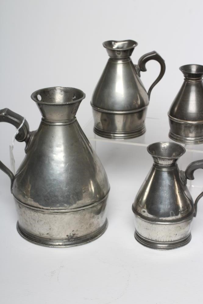 Nine various pewter haystack measures, including a quart, two pints ...