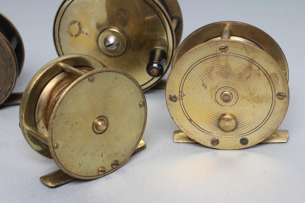 Four antique brass fishing reels | Hartleys Auctioneers & Valuers