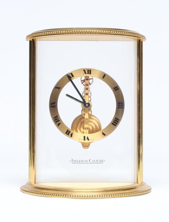 A jaeger-lecoultre skeleton mantel clock with exposed gilt brass ...