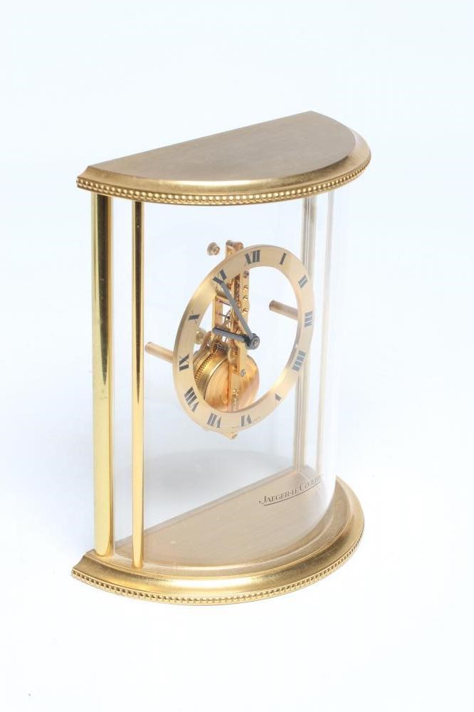 A jaeger-lecoultre skeleton mantel clock with exposed gilt brass ...