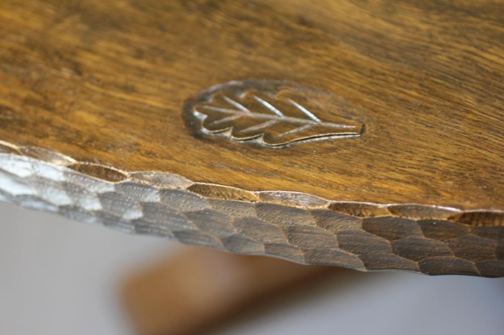 A david langstaff adzed oak dining table, the circular top with adzed ...