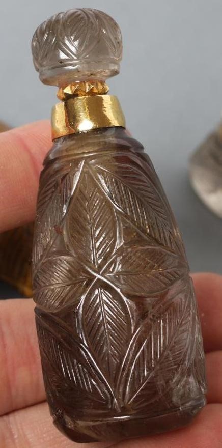 A banded agate perfume bottle and stopper carved and polished in low ...