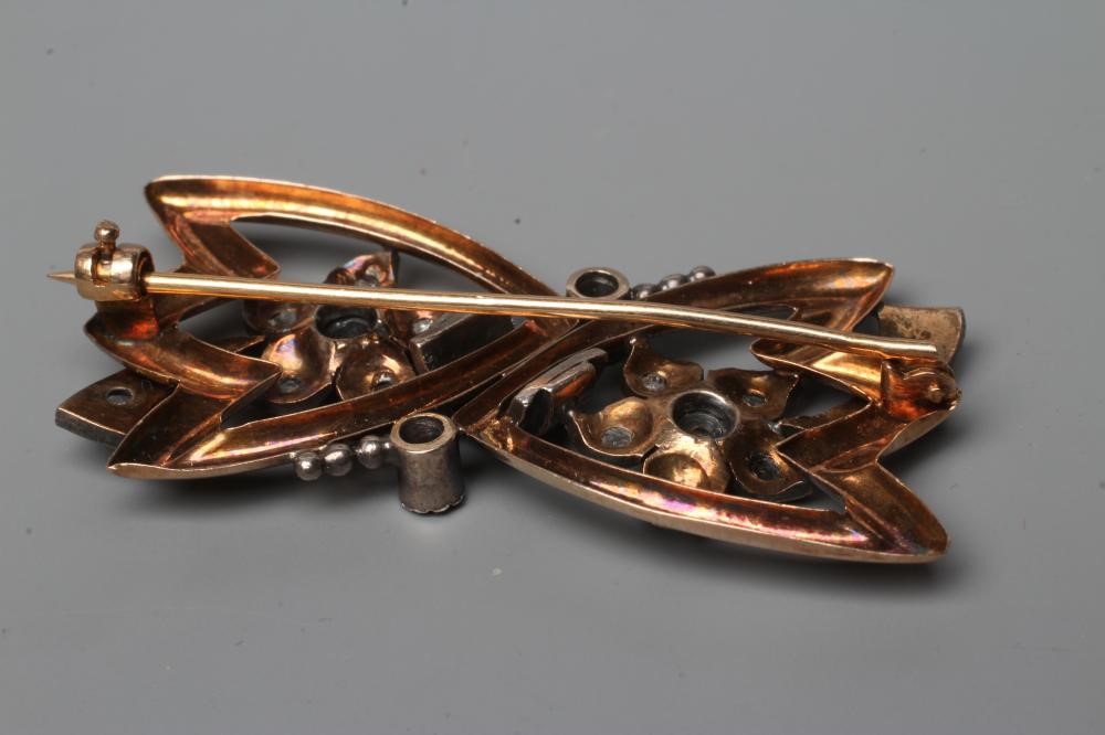 An art deco diamond and ruby bow brooch | Hartleys Auctioneers & Valuers