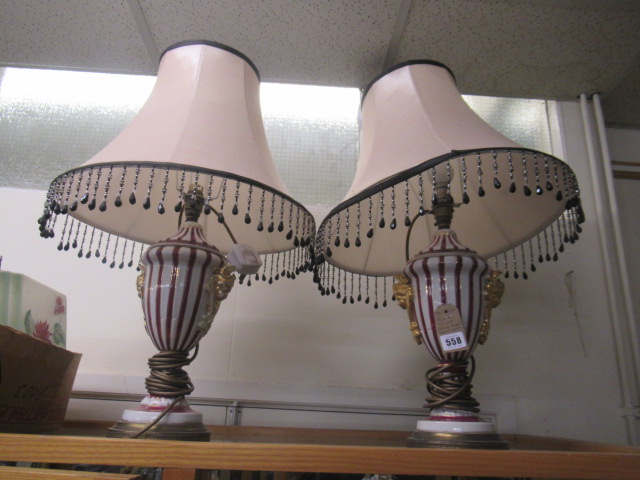 Pair of ornate cherub handle ceramic lamps | Hartleys Auctioneers & Valuers