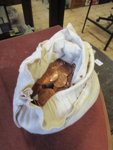 Five pound bag of mint 1967 pennies | Hartleys Auctioneers & Valuers