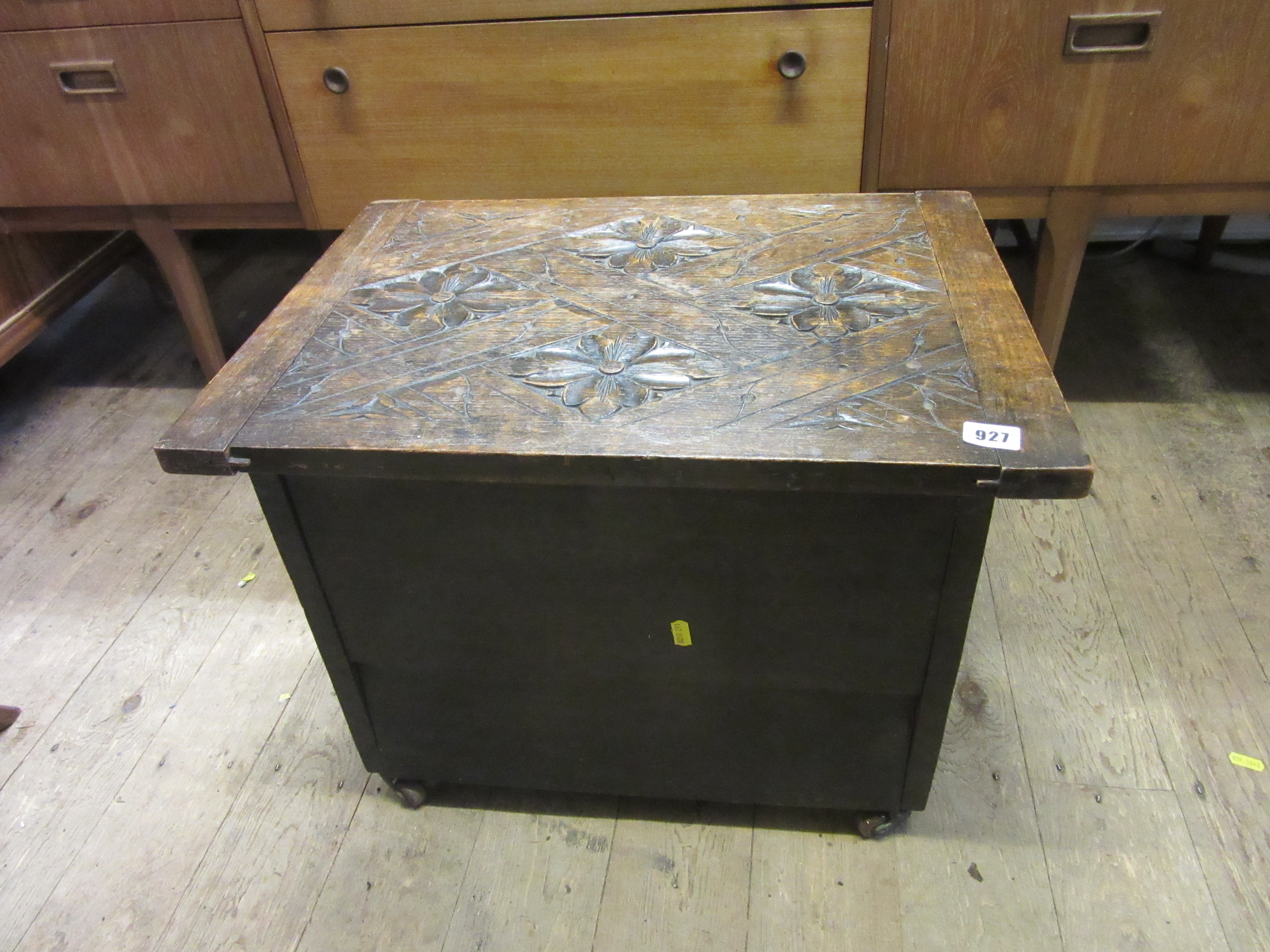 Oak carved storage box on castors | Hartleys Auctioneers & Valuers