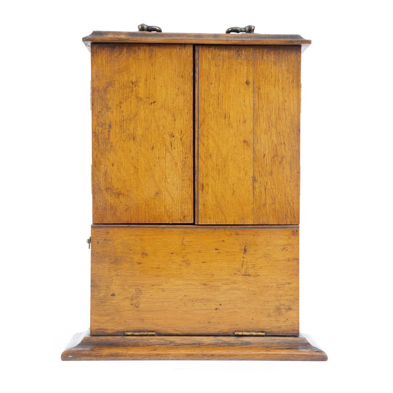 A late victorian oak key cabinet | Woolley and Wallis
