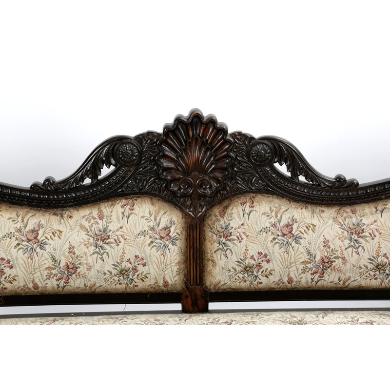 An anglo-indian ebony scroll end sofa | Woolley and Wallis