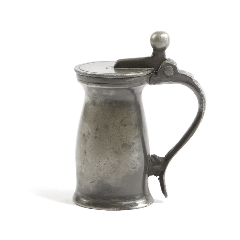 A scarce 'ball and bar' pewter baluster measure | Woolley and Wallis