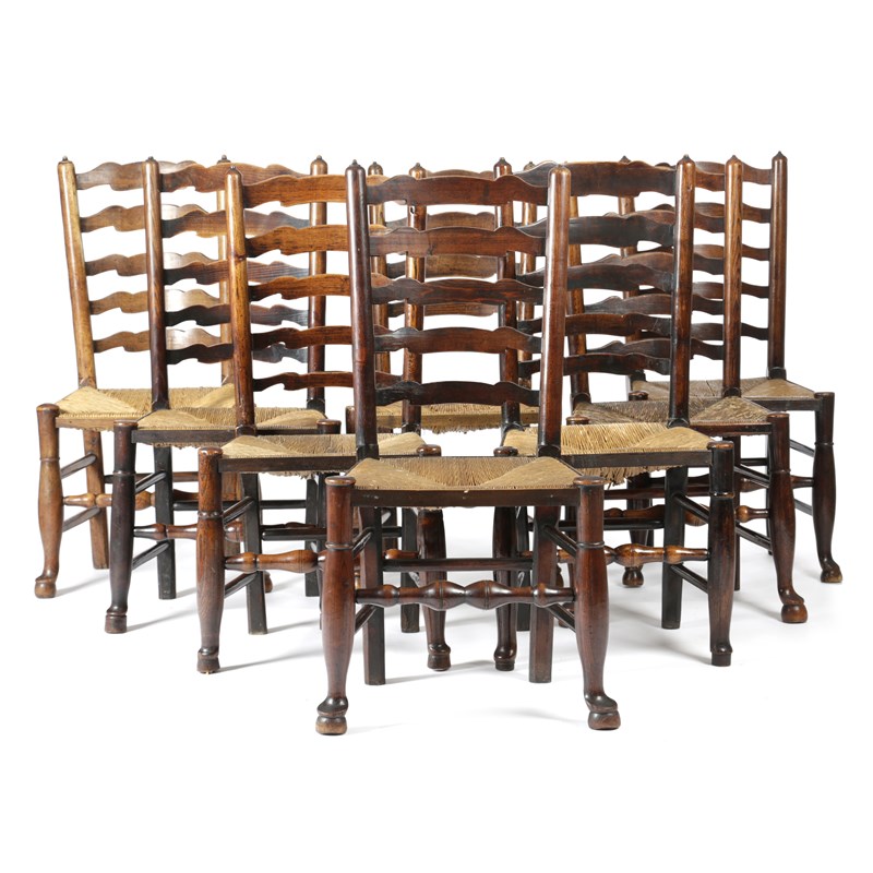 A harlequin set of eight ash ladder back dining chairs | Woolley and Wallis