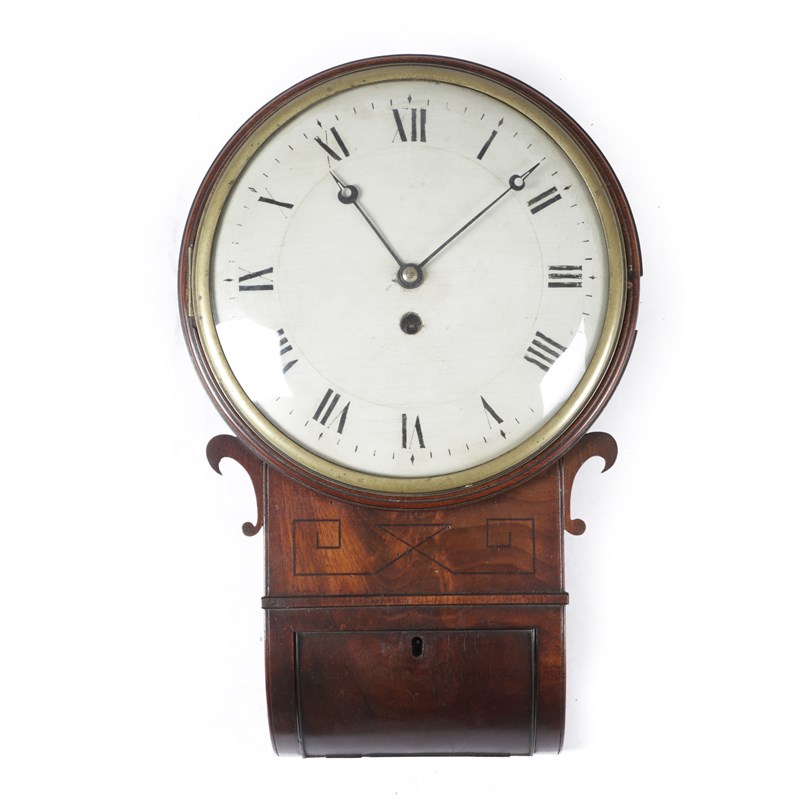 A mahogany drop-dial wall clock | Woolley and Wallis