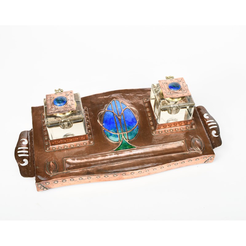 A large copper and enamel twin inkwell, rectangular, stamped in low ...