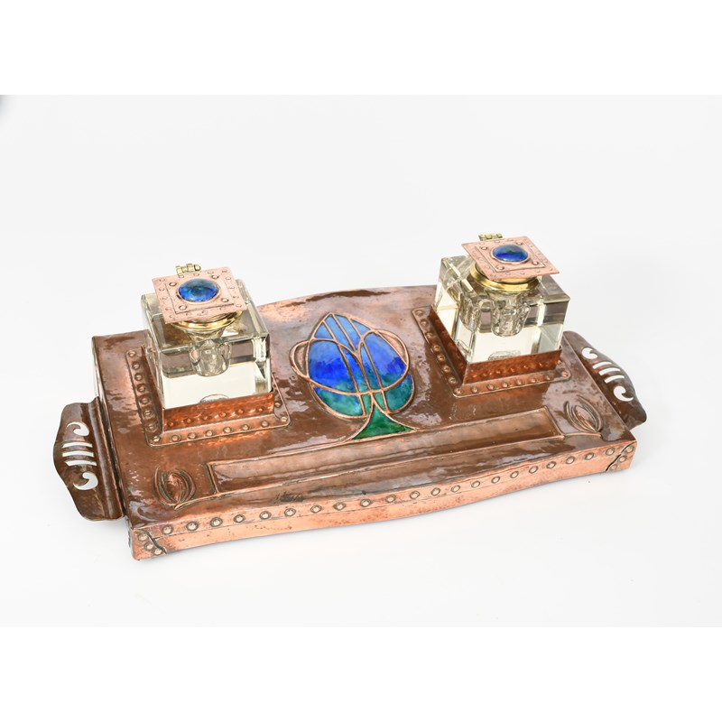 A large copper and enamel twin inkwell, rectangular, stamped in low ...