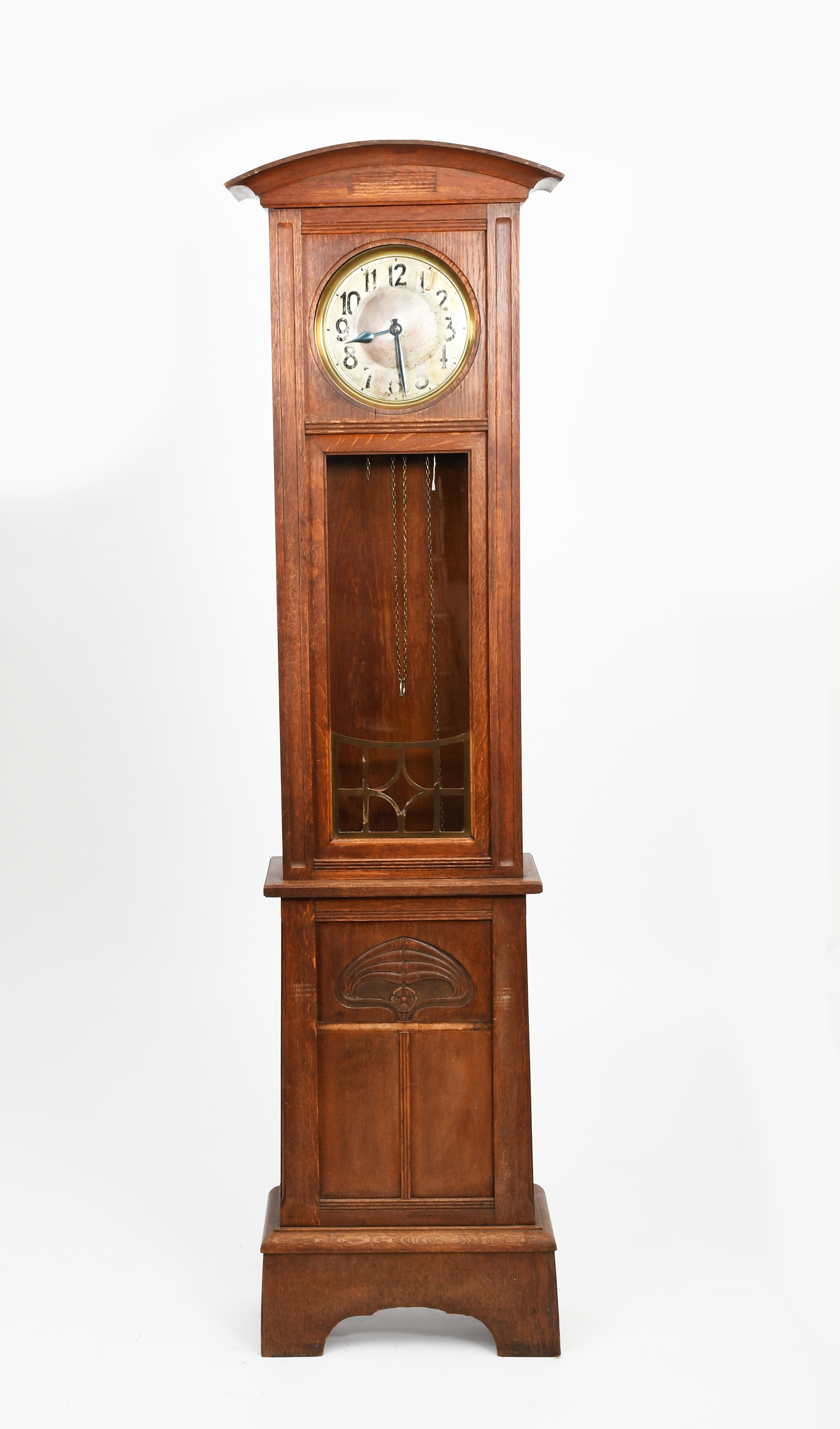 An Arts and Crafts oak Grandfather clock, rectangular case with carved ...