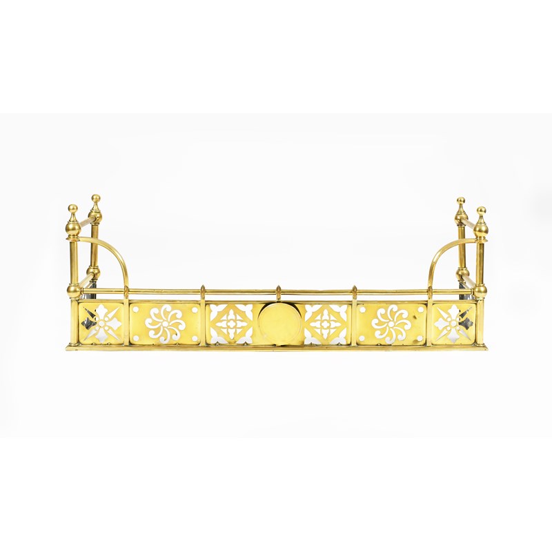 An aesthetic movement brass fender, the rectangular front panels with ...