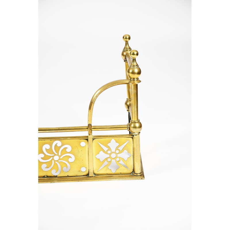 An aesthetic movement brass fender, the rectangular front panels with ...
