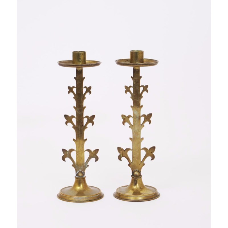 A rare john hardman & co pair of brass candlesticks designed by a.w.n ...