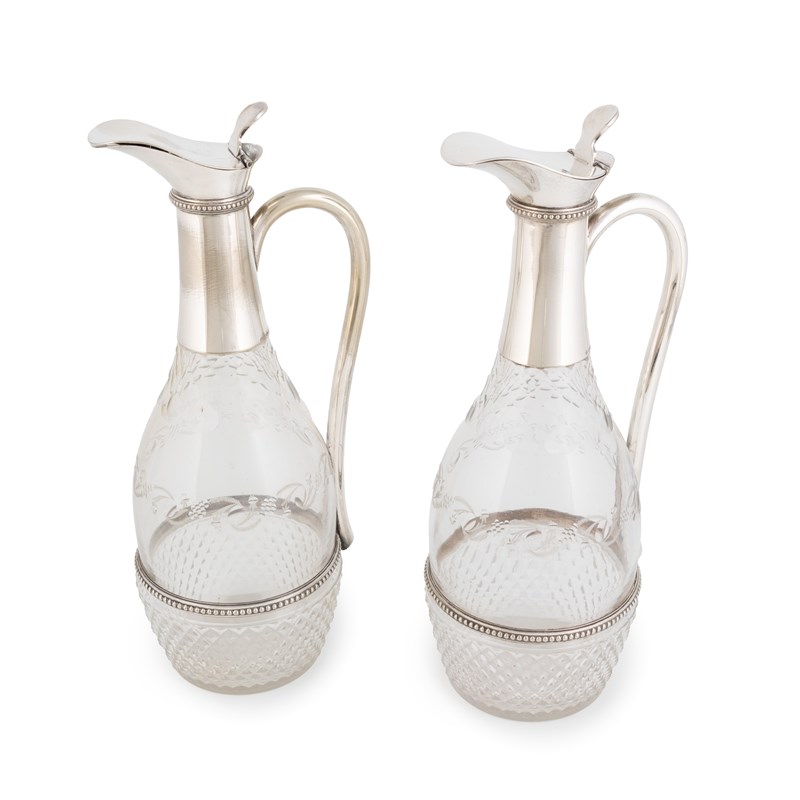 A pair of german electroplated-mounted glass claret jugs | Woolley and ...