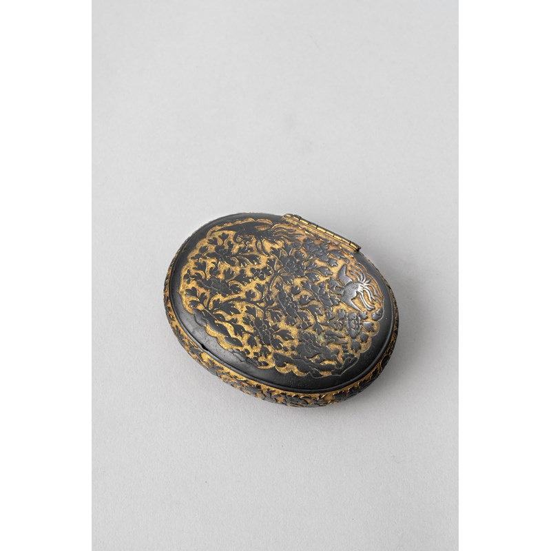 A japanese parcel-gilt bronze sawasa tobacco box | Woolley and Wallis