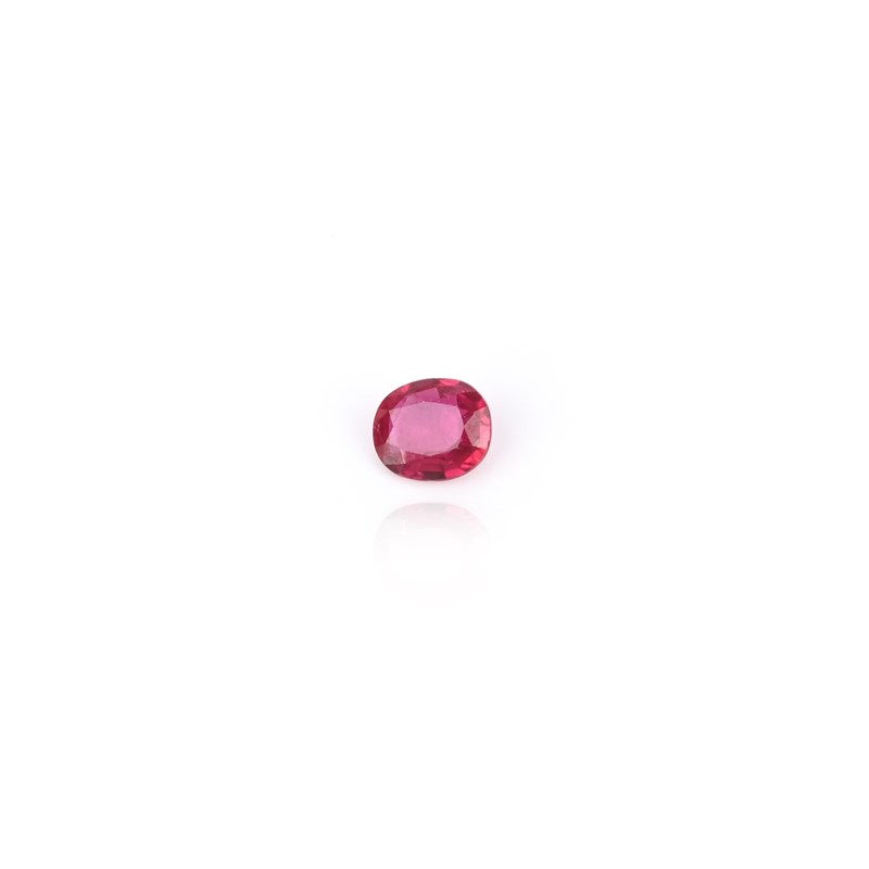 an unmounted ruby, the oval ruby weighing 1.25 carats | Woolley and Wallis