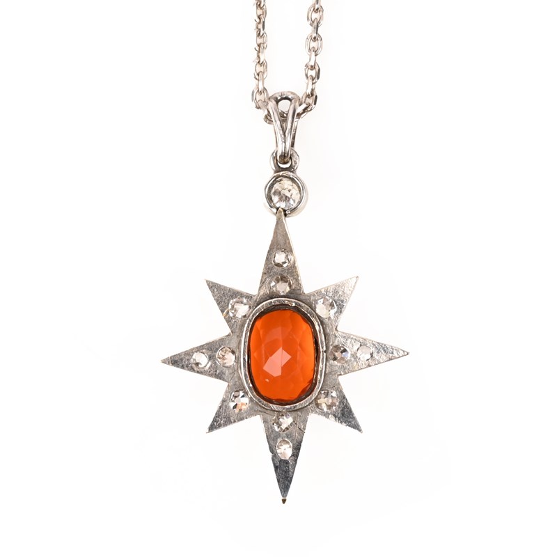 A fire opal and diamond pendant necklace | Woolley and Wallis