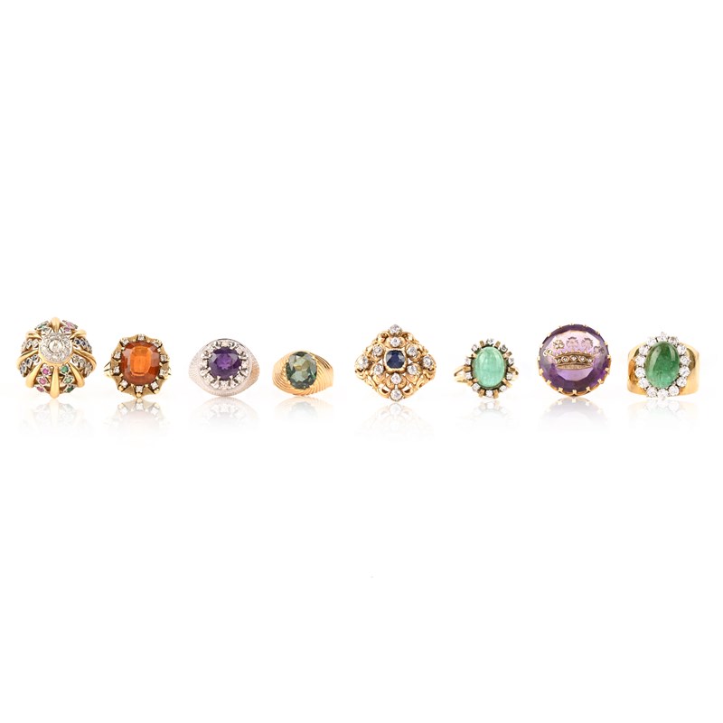A collection of eight gem-set gold rings | Woolley and Wallis