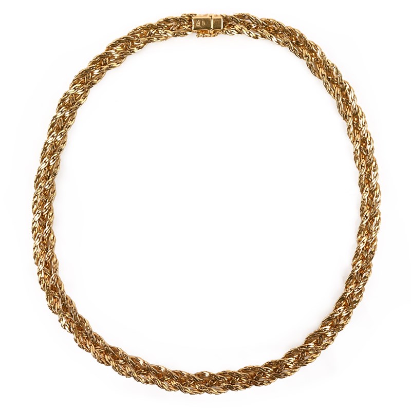 A gold necklace | Woolley and Wallis
